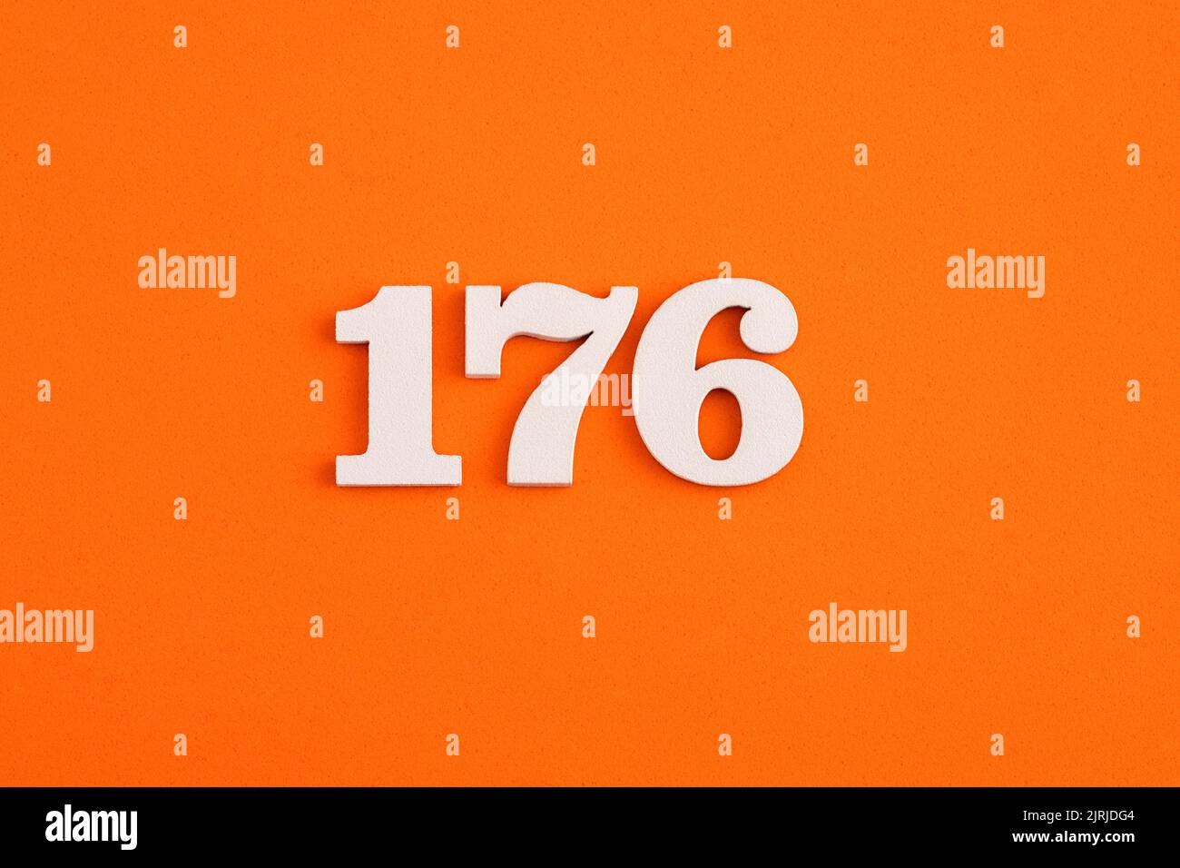 White wooden number 176 on eva rubber orange background Stock Photo - Alamy