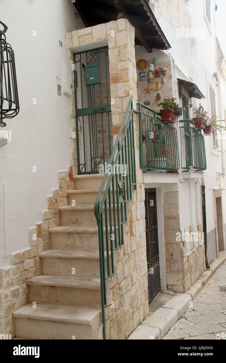 Narrow steps to the entrance in a residential building in the ...