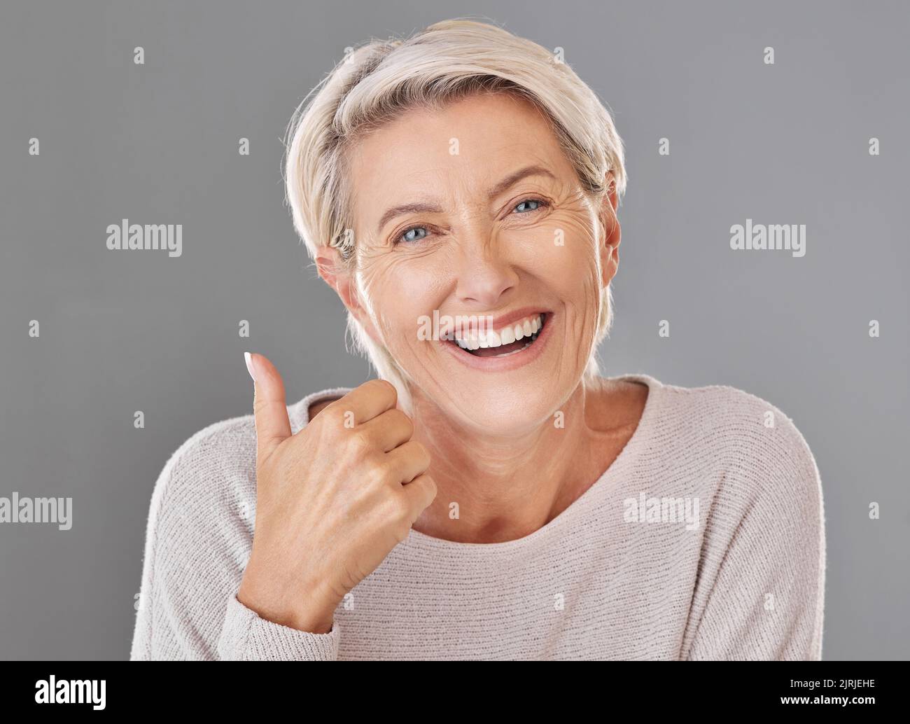 Skincare Wellness And Thumbs Up By Happy Mature Woman Smiling Showing Winning Hand Gesture