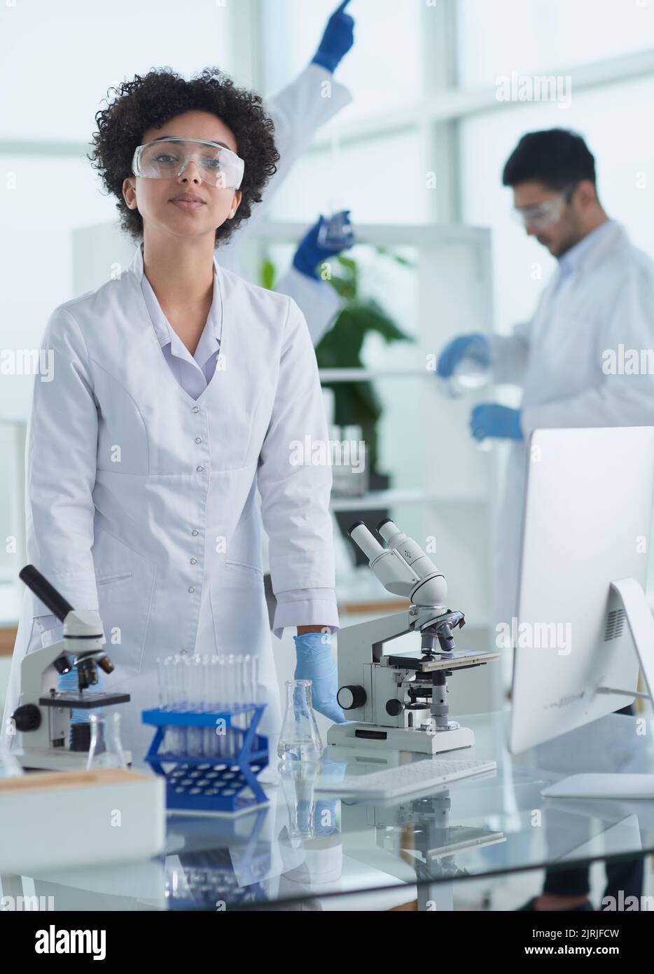 Scientists looking camera in laboratory hi-res stock photography and ...