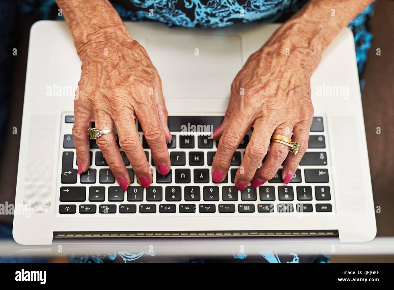 Life experience makes for great blog content. a senior woman typing on ...