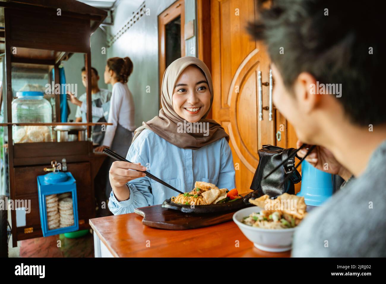 Female seller serving customer hi-res stock photography and images - Alamy