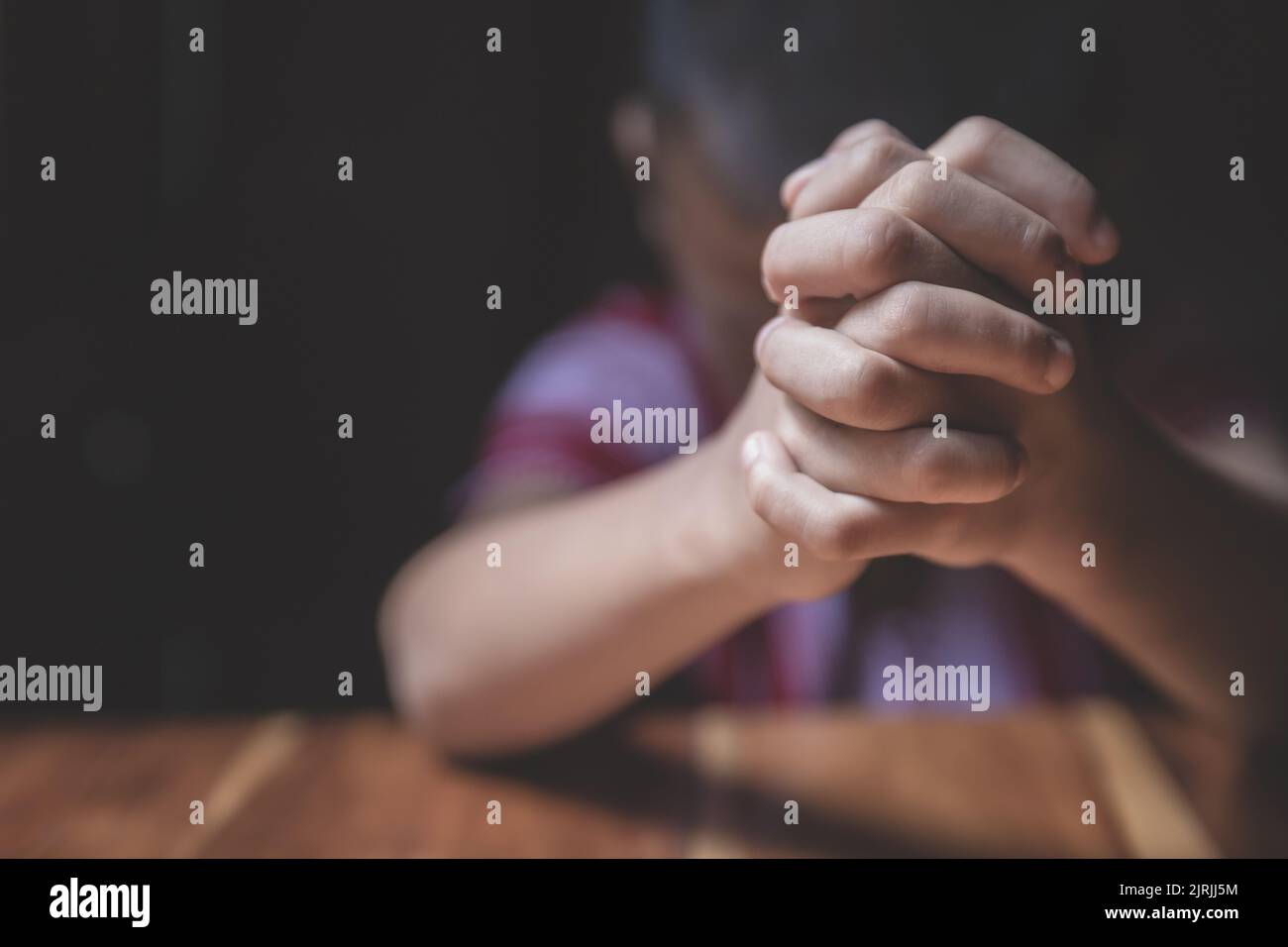 A little prayer, A boy is praying seriously and hopefully to Jesus ...