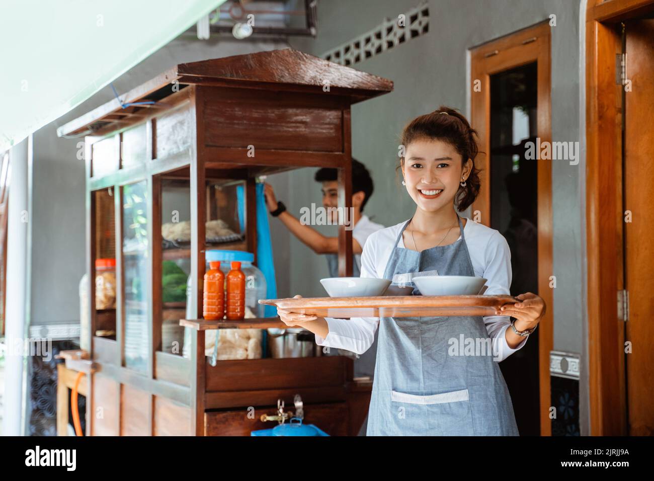 Male carrying tray hi-res stock photography and images - Alamy