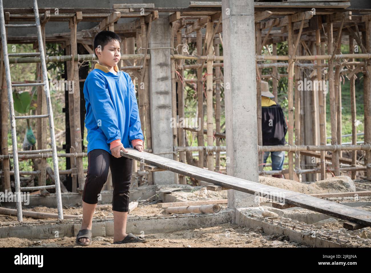 Against child labor. Children working hard at construction sites. Child ...