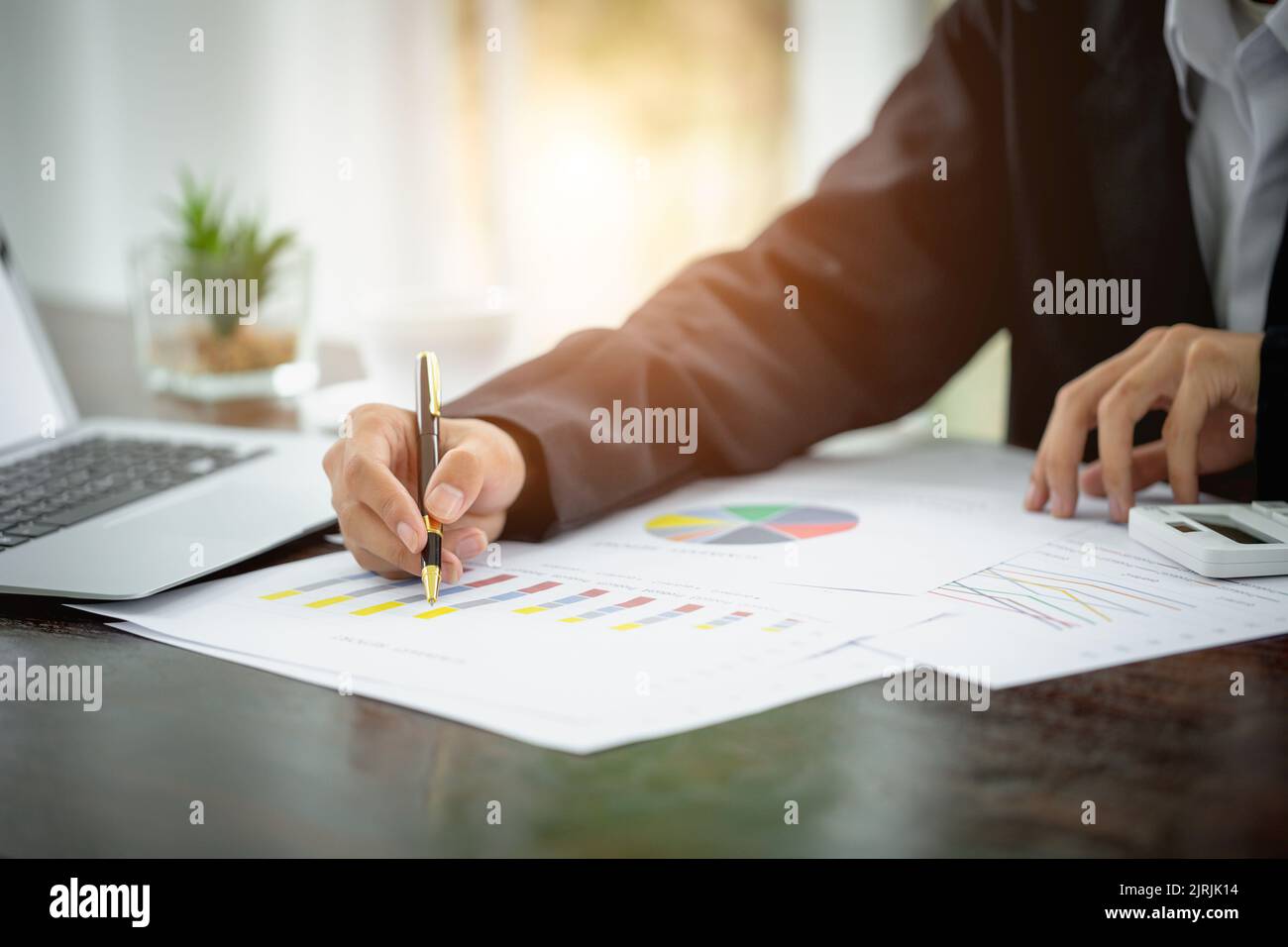 Business man holding charts graphs hi-res stock photography and images ...