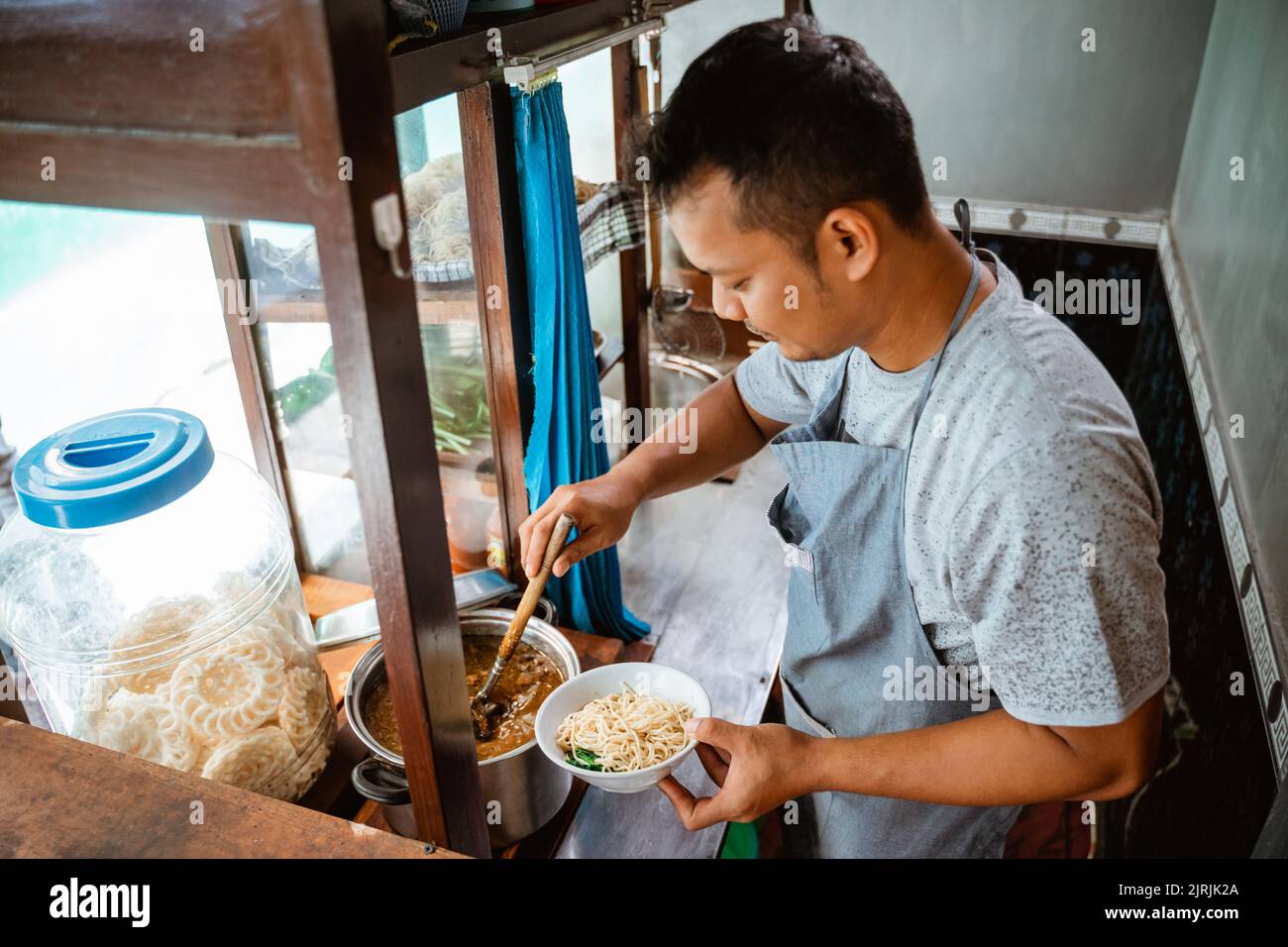 Cuisine man young cook noodles hi-res stock photography and images - Alamy