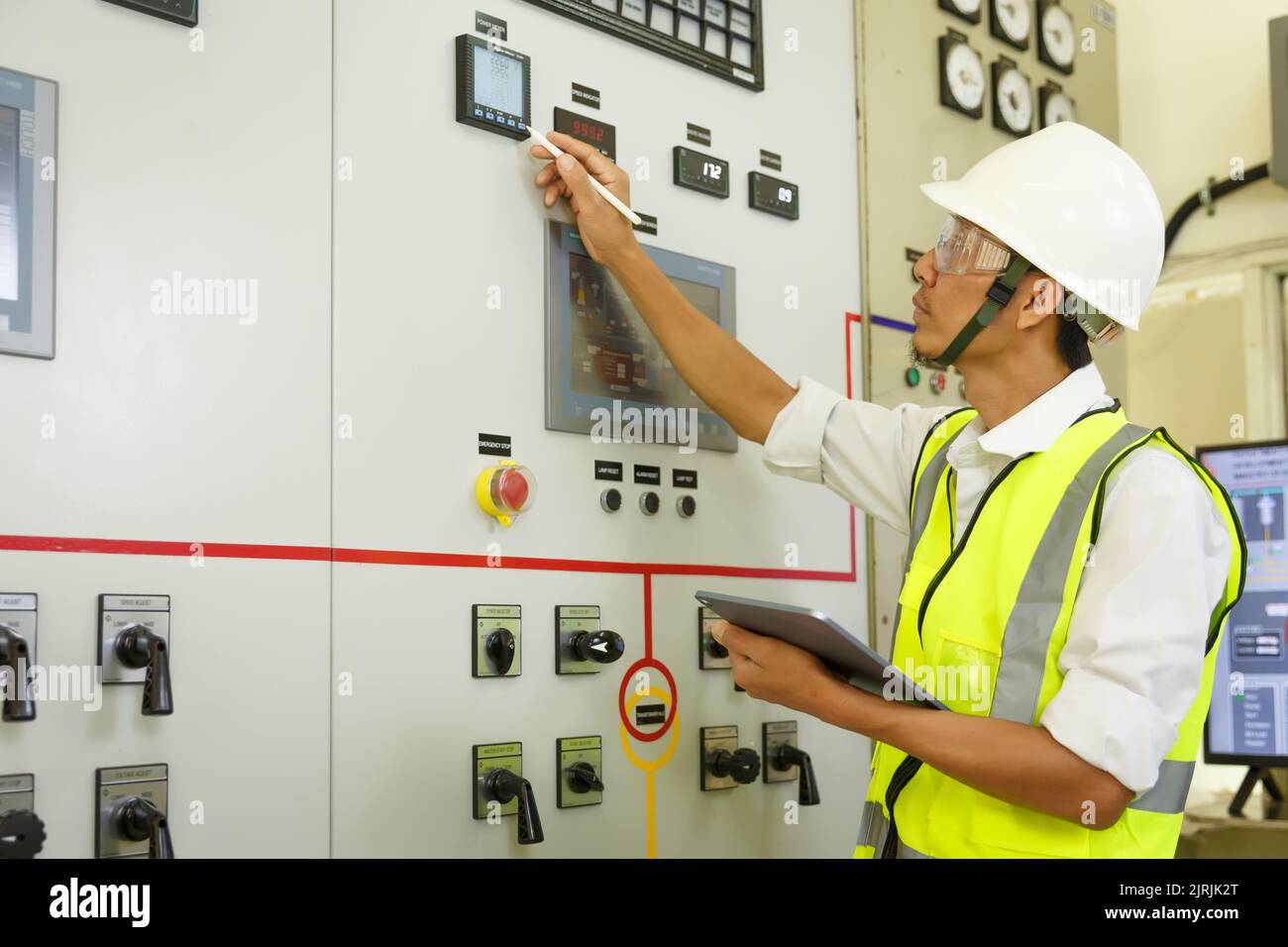 Engineer working on the checking status switchgear electrical energy ...