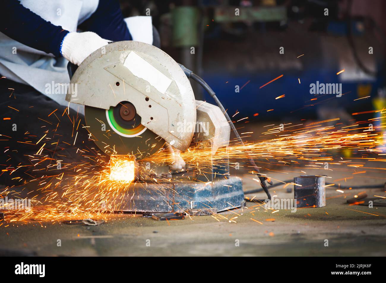 Cutting of a steel with splashes of sparks, Metal processing with angle ...