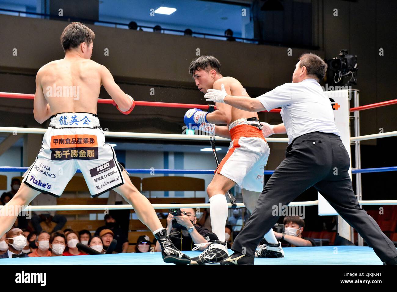 Gonte Lee (red gloves) and Moo Hyun Kim (blue gloves) compete during ...