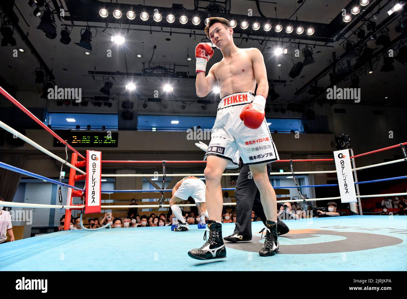 Gonte Lee (red gloves) and Moo Hyun Kim (blue gloves) compete during ...