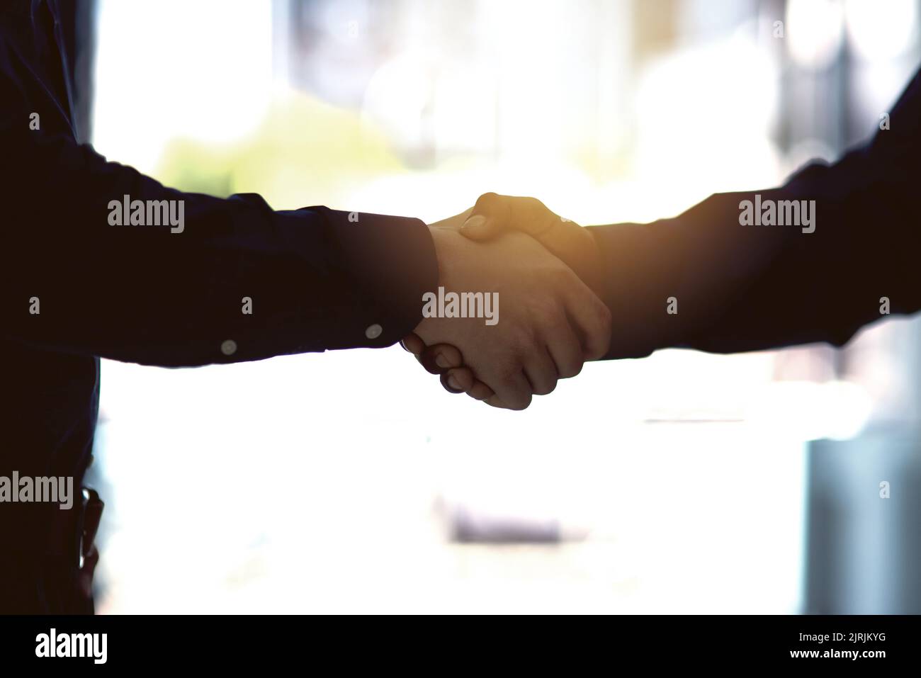 Two entrepreneur shaking hands inside hi-res stock photography and ...