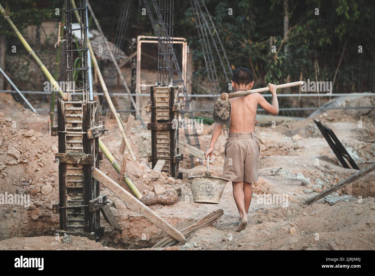 Poor children at the construction site were forced to work. Concept ...