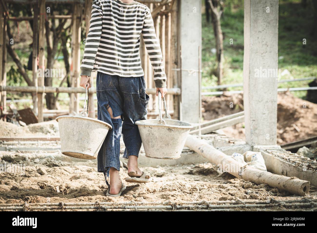 Children working at construction sites are forced to work. The concept ...