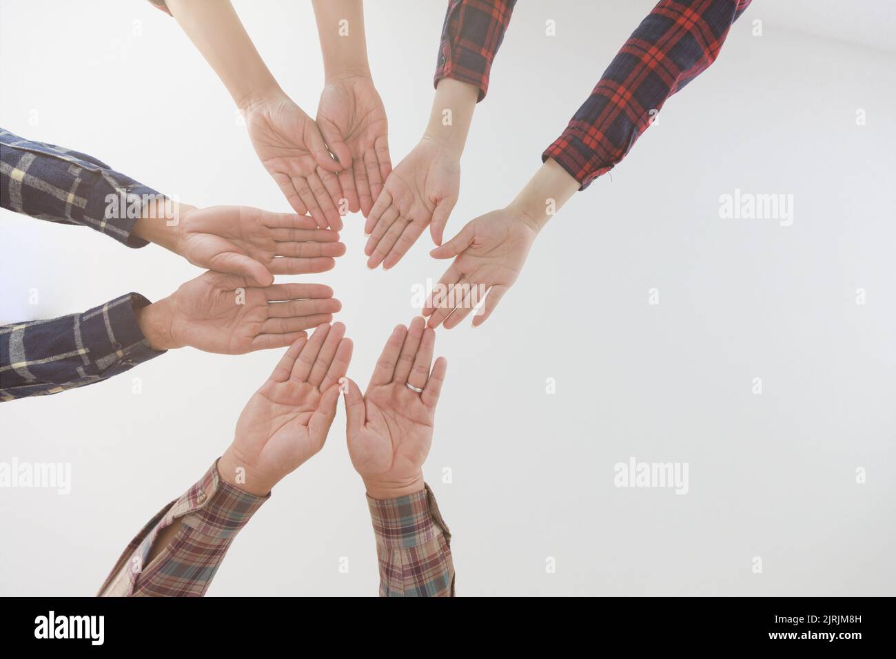 Young businessmen put their hands together, Working as a team together ...