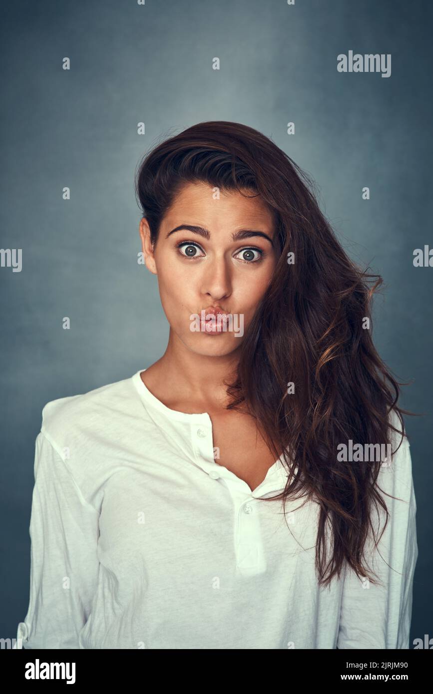 Doing her best goldfish impersonation. Portrait of a beautiful young ...