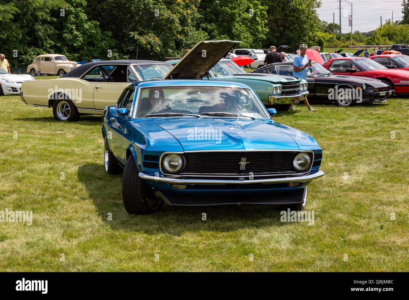 A classic blue 1970 Ford Mustang on display at a car show in Fort Wayne ...