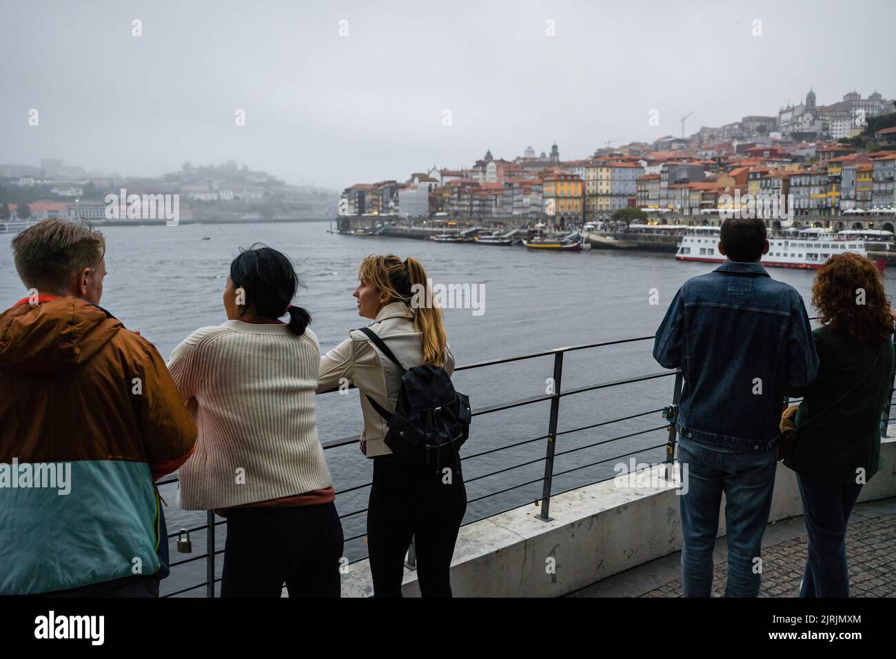 Porto, Portugal. 24th Aug, 2022. Tourists and locals seen under Porto's ...