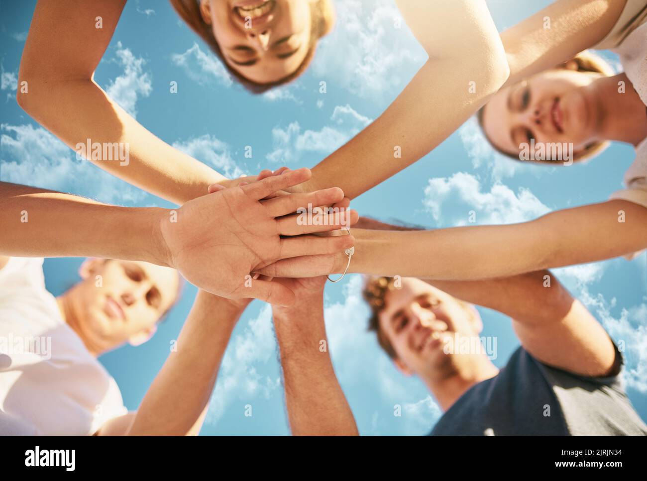 Stronger when we stand together. Low angle shot of a group of young ...