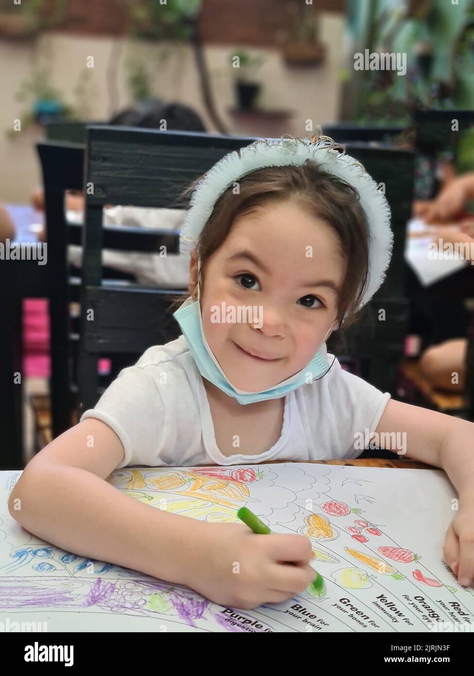 Happy pretty kid girl paint in kindergarten lesson Stock Photo - Alamy