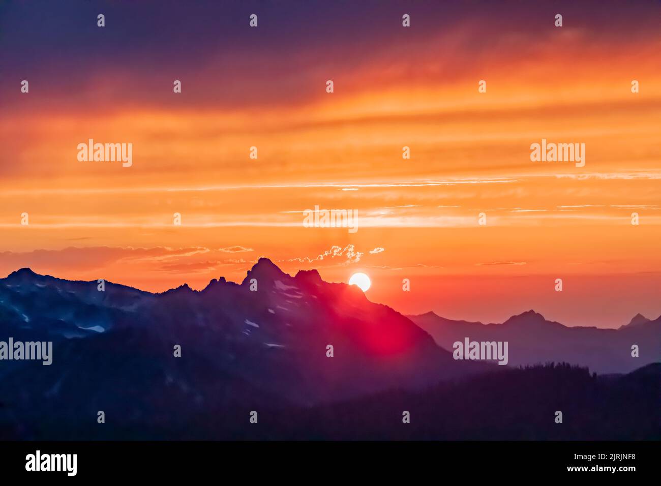 Smoky sunset over the mountains viewed from Evergreen Mountain Lookout ...