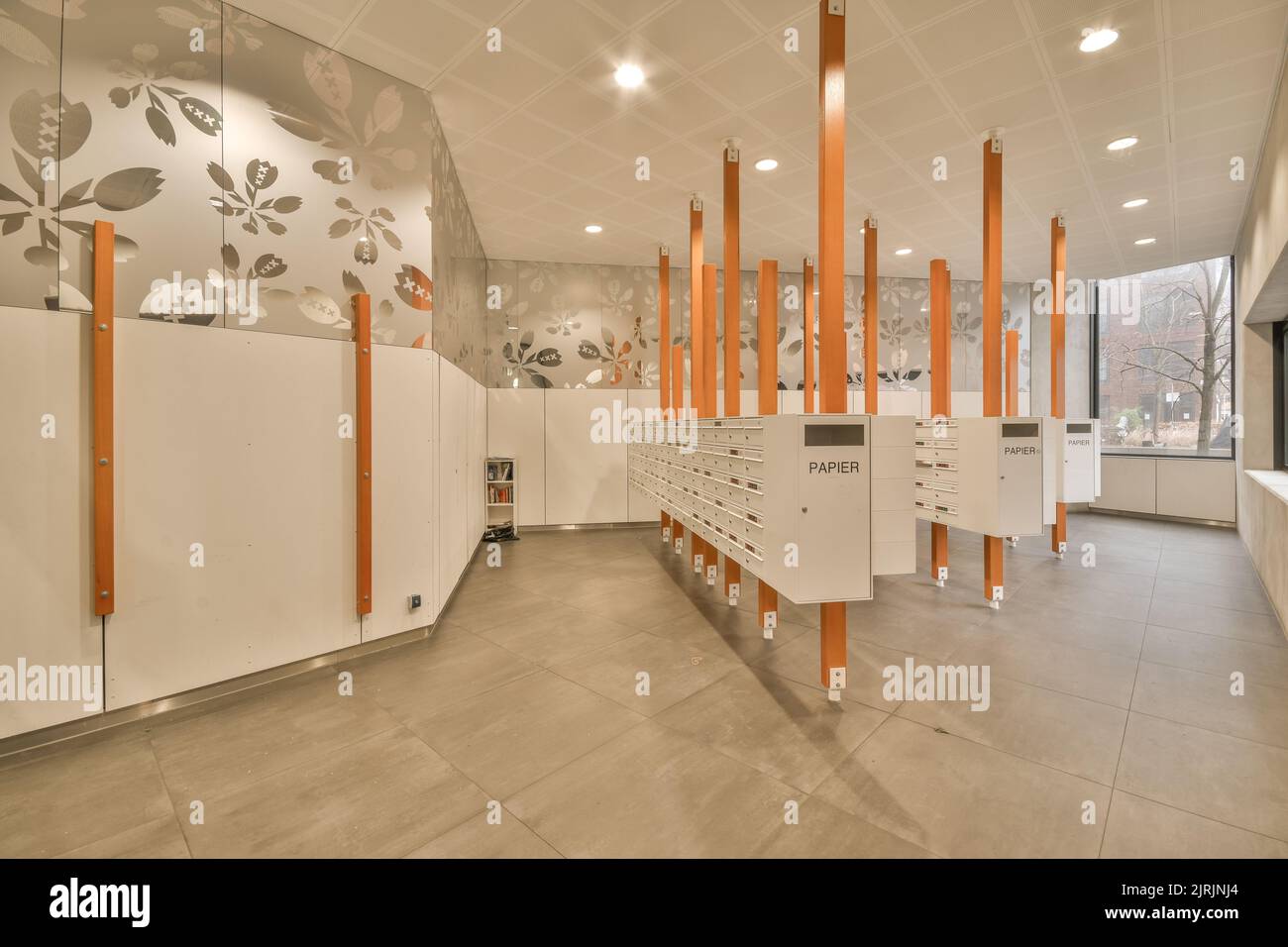 Light hallway with entrance door in two level apartment with minimalist ...