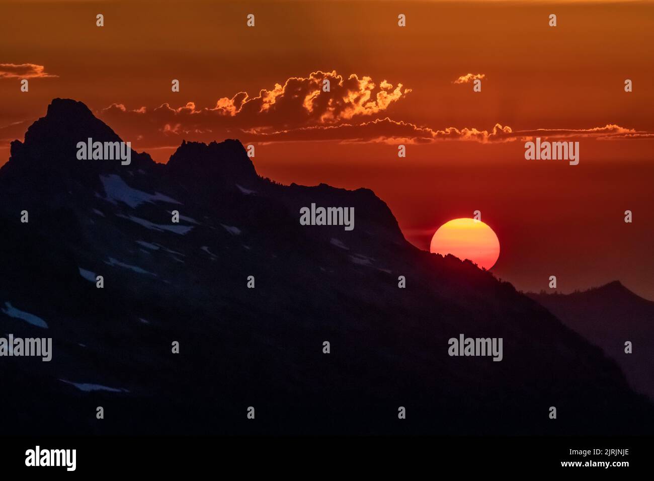 Smoky sunset over the mountains viewed from Evergreen Mountain Lookout ...