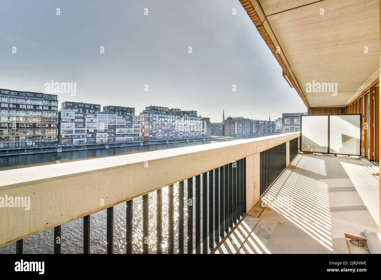Panoramic view of old buildings with parking and trees from small ...