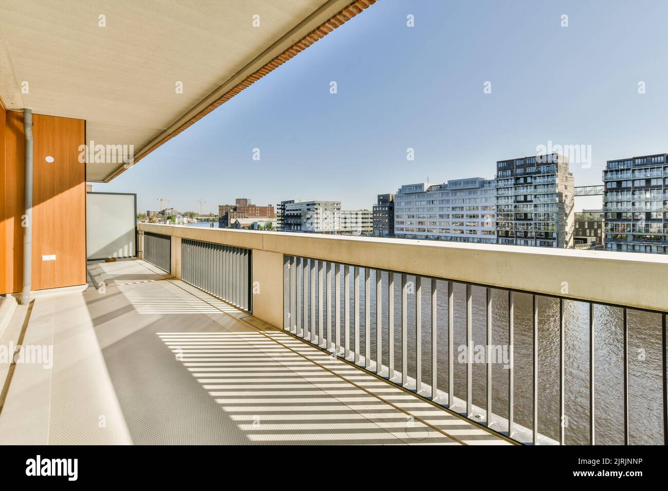 Panoramic view of old buildings with parking and trees from small ...