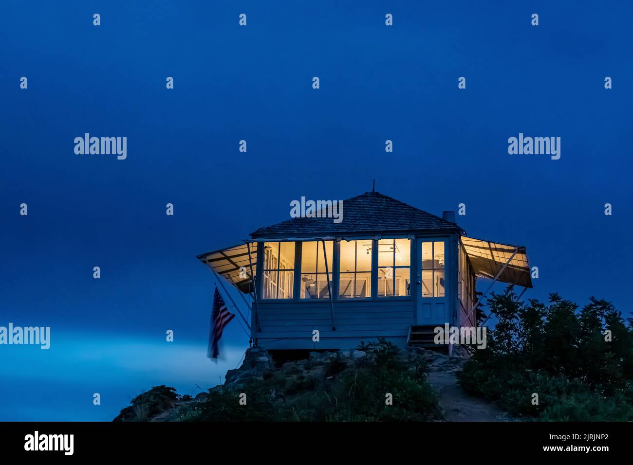 Twilight at Evergreen Mountain Lookout, with visitors renting the ...