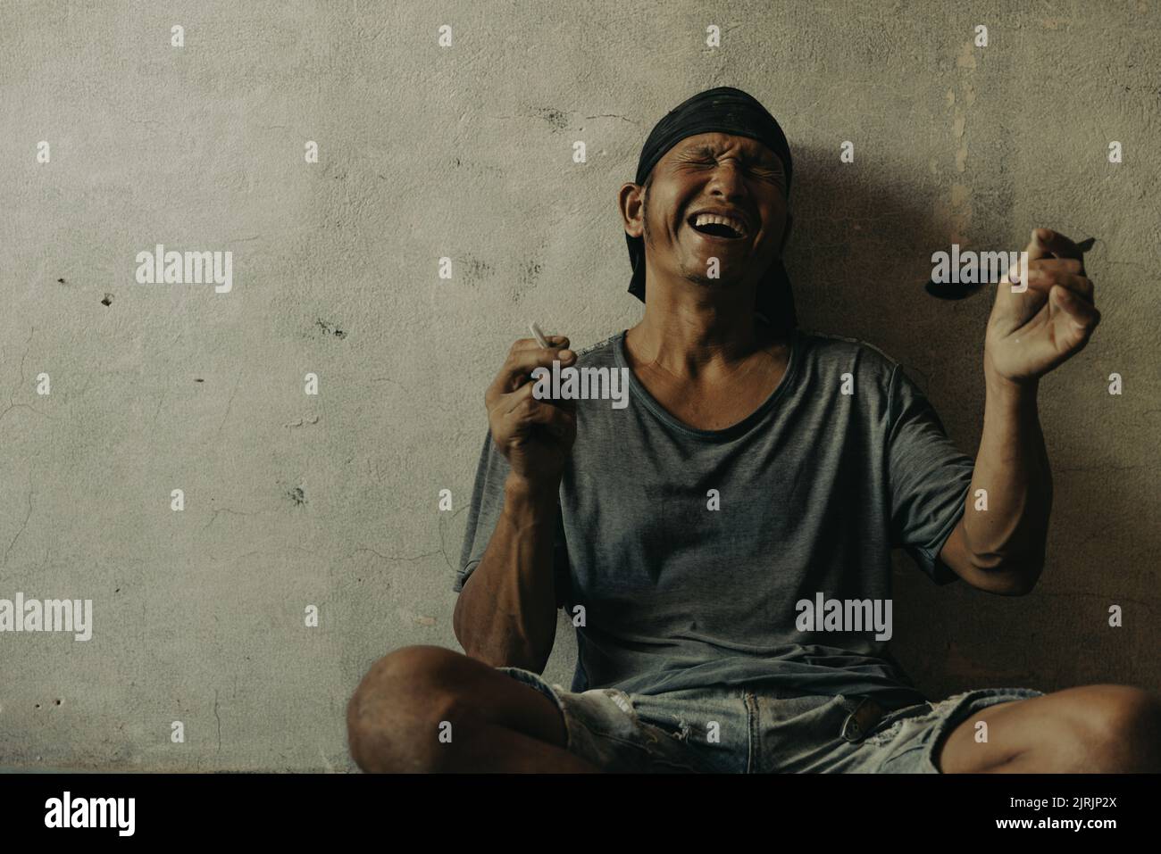 Drug addict man with hallucinations, Drug addict man with syringe using ...