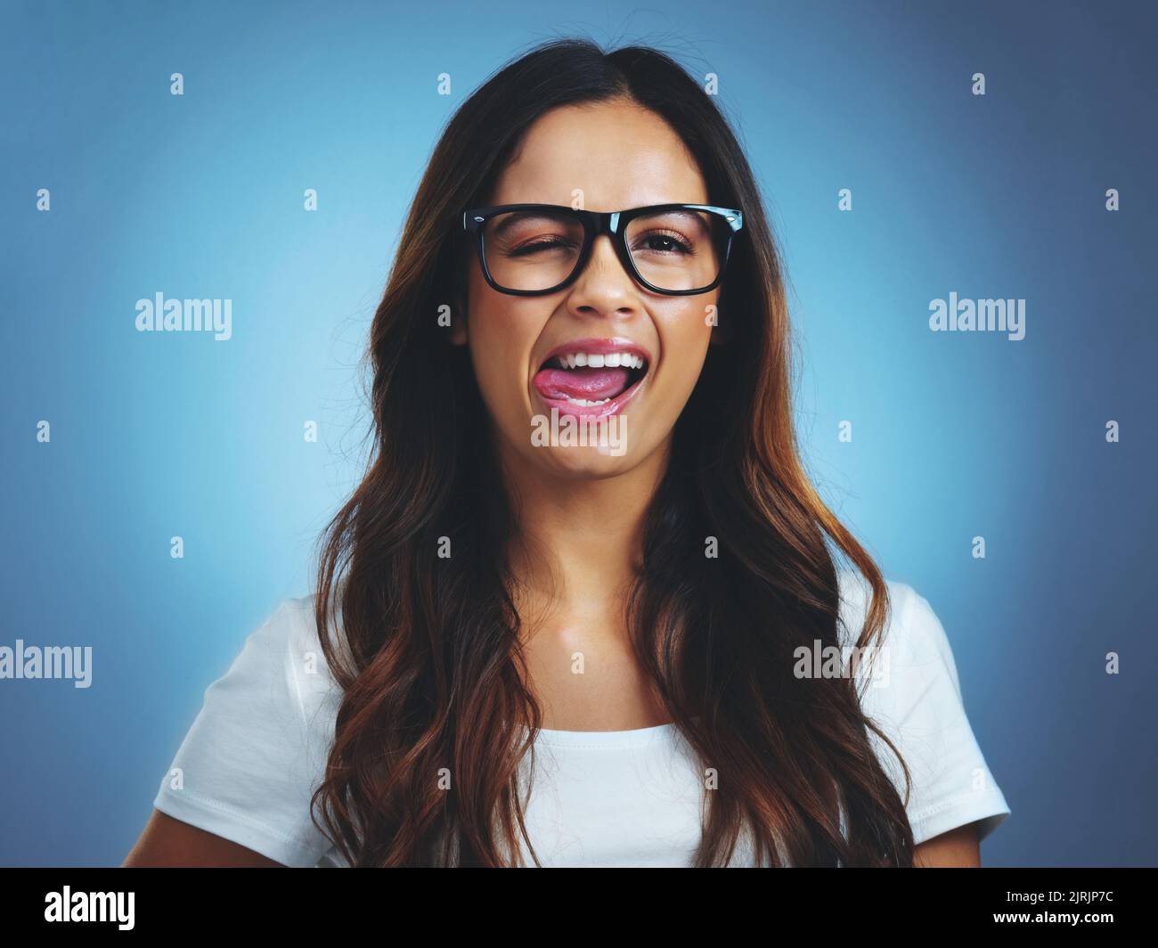She sure can be cheeky at times. Studio portrait of an attractive young woman sticking her ...