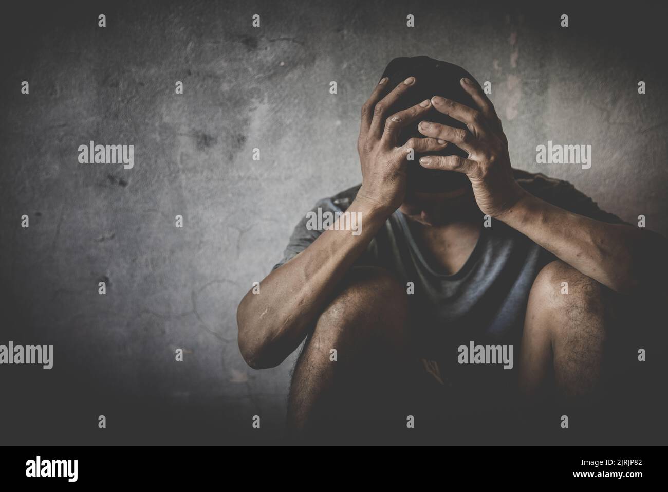 Men who show stress and loneliness, Homeless man drug addict sitting ...