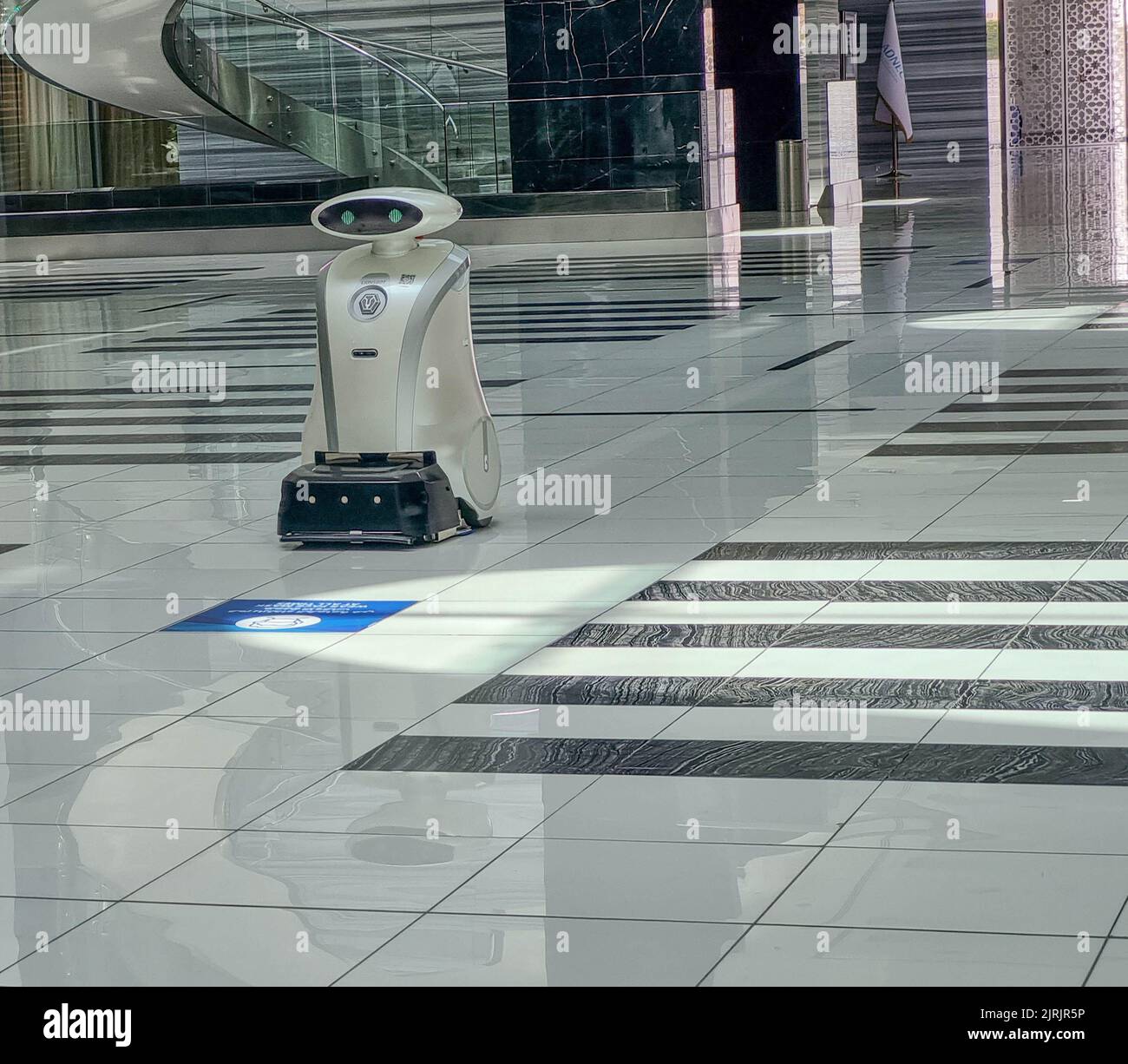 Abu Dhabi, UAE - 08.04.2022 - Robot assistant in the hall way at ADNEC ...