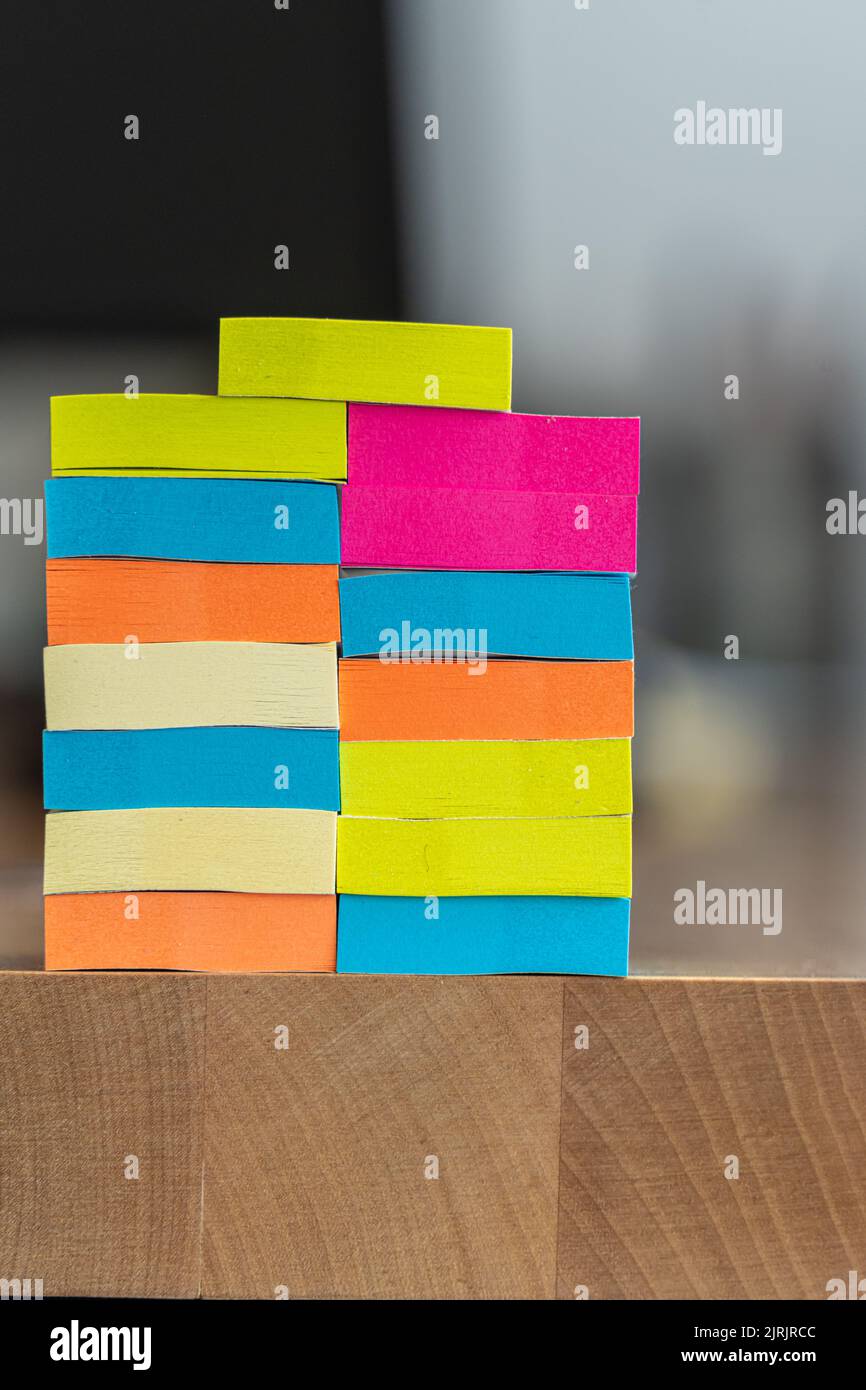 pile of sticky notes on office table at work Stock Photo - Alamy