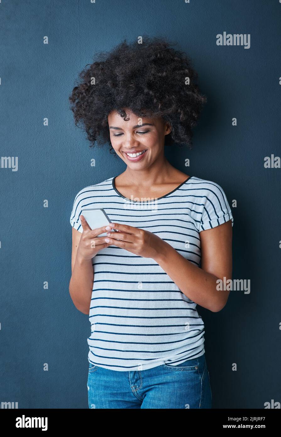 Seeing their name on your phone and instantly smiling. Studio shot of ...