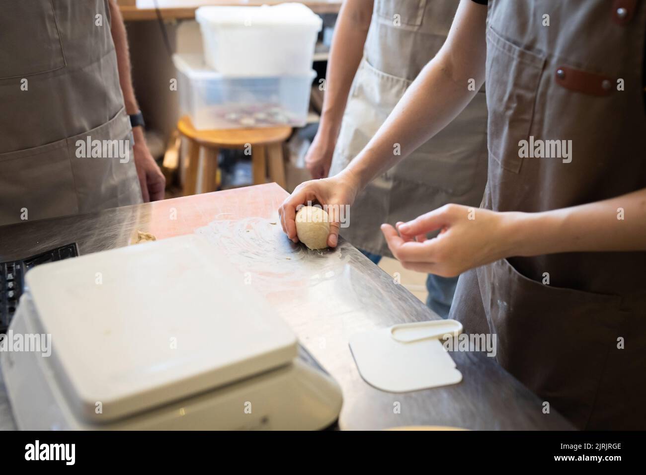 The process of learning the craft of baking in a small bakery, molding ...