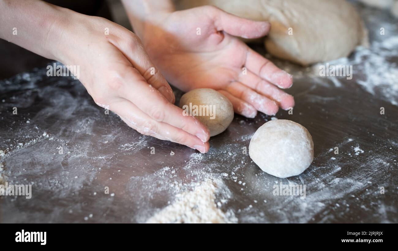 The process of learning the craft of baking in a small bakery, molding ...