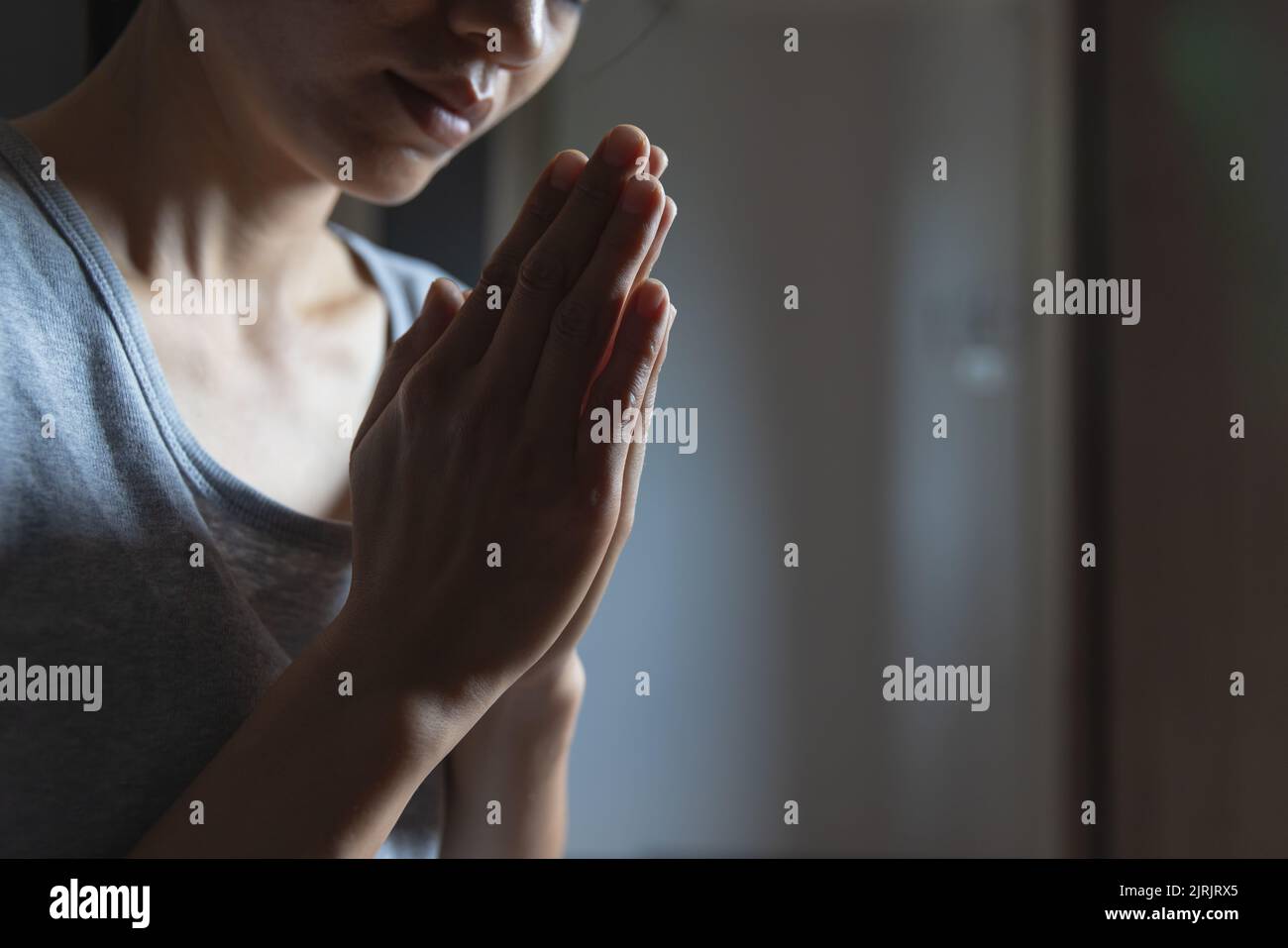 woman Praying hands with faith in religion and belief in God. Namaste or Namaskar hands gesture ...