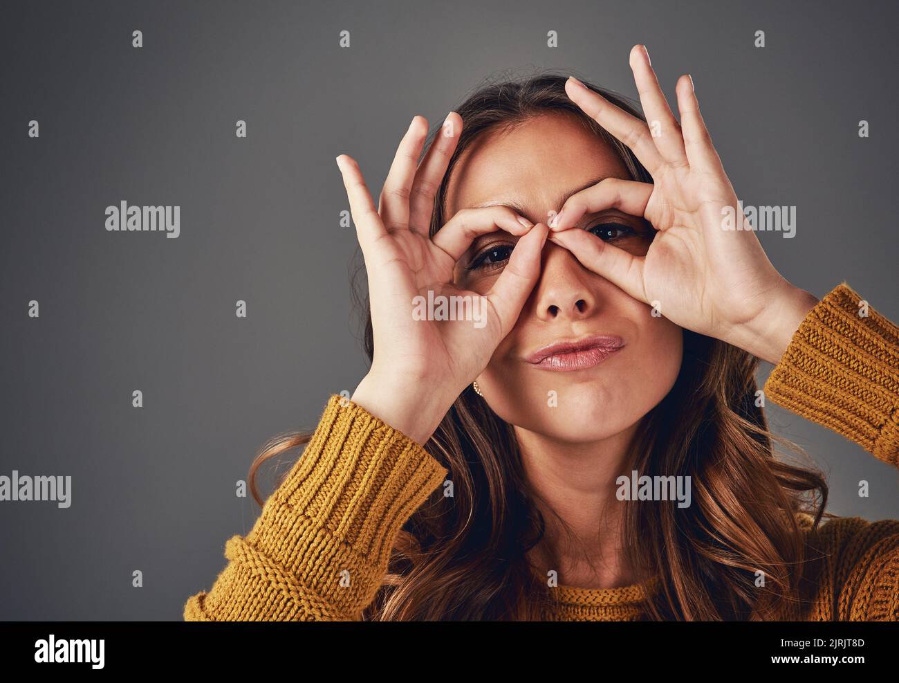 Lets see if I can get a better view. Studio portrait of an attractive ...