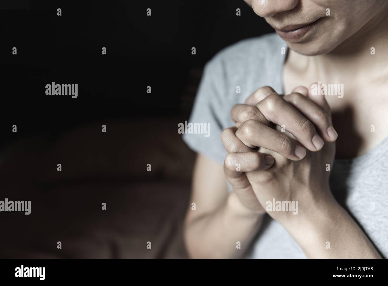Hand of woman while praying for christian religion, Casual woman ...