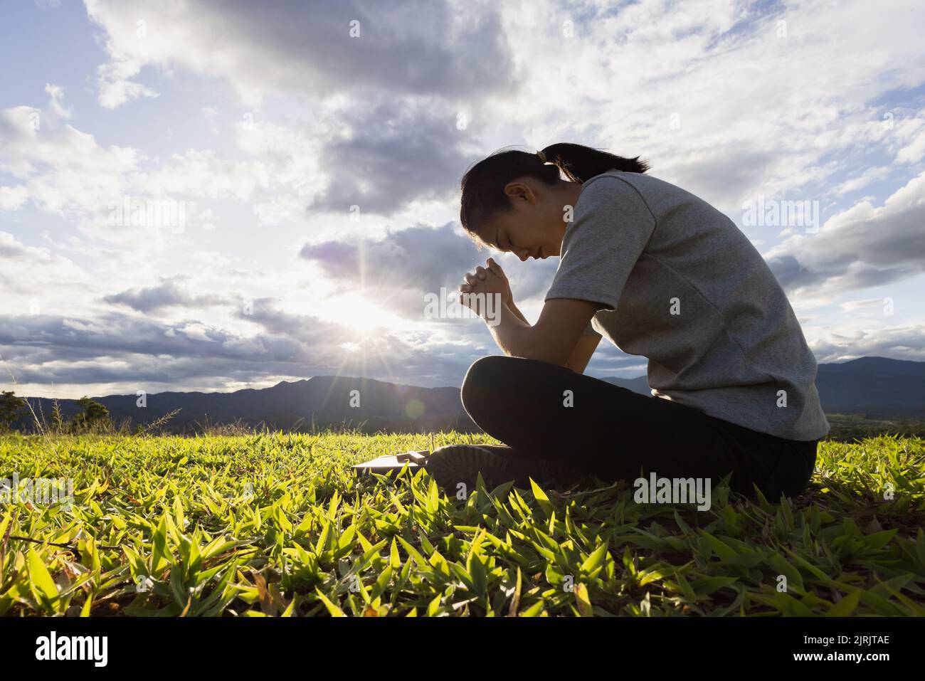 Woman praying for thank god praying with her hands together to think of ...
