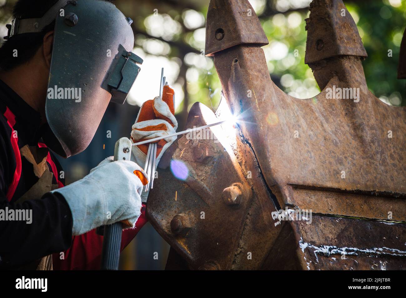 Specialist welder weld construction frame, welding spark , Welder is ...