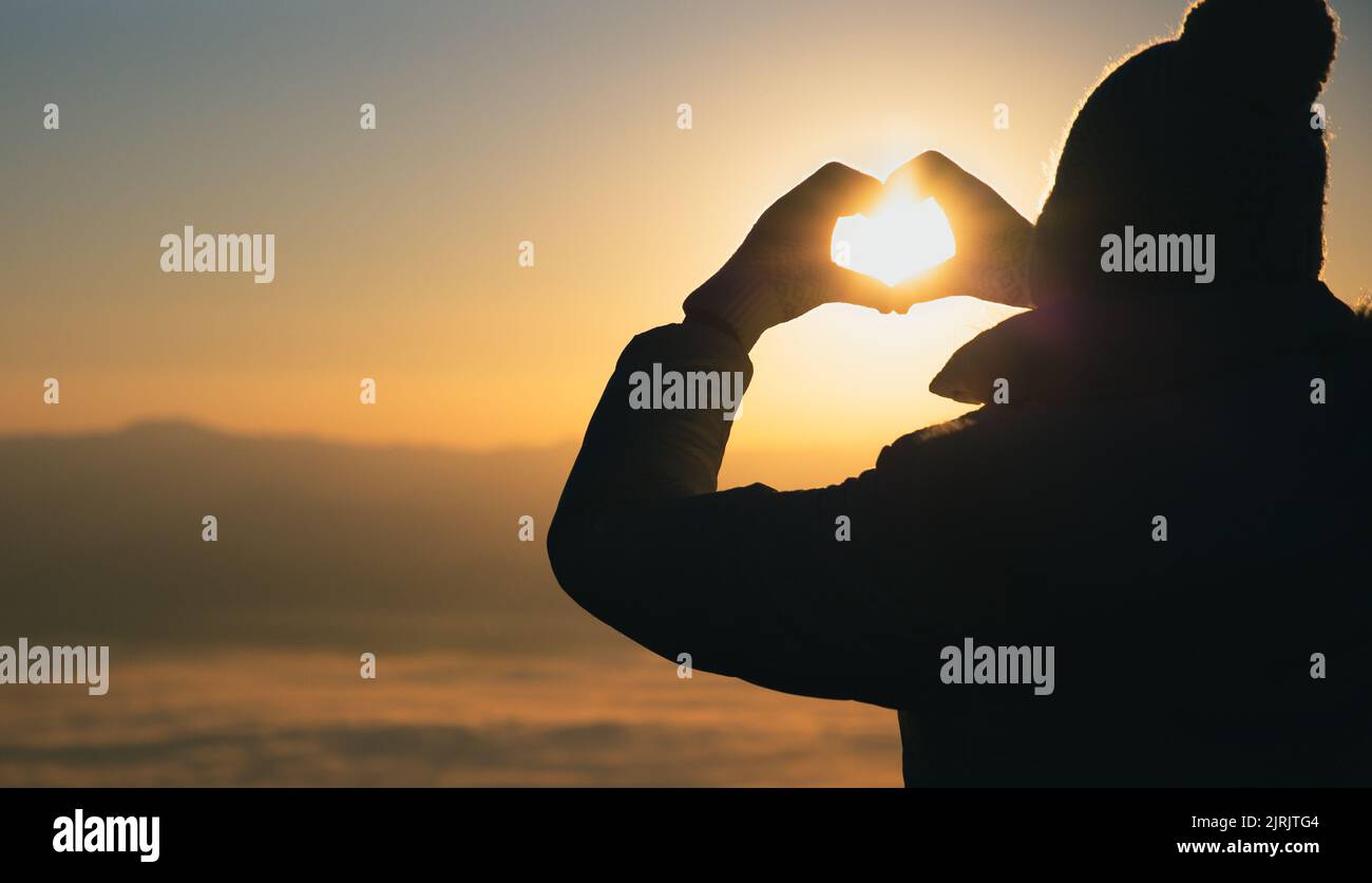 Silhouette woman hands rise hi-res stock photography and images - Alamy