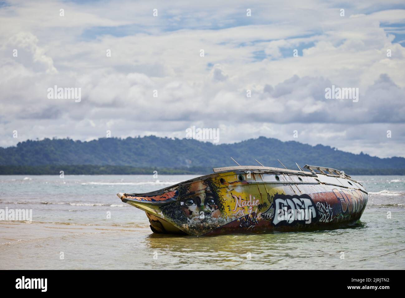 A wrecked ship with painting on the beach in Puerto Viejo, Costa Rica ...