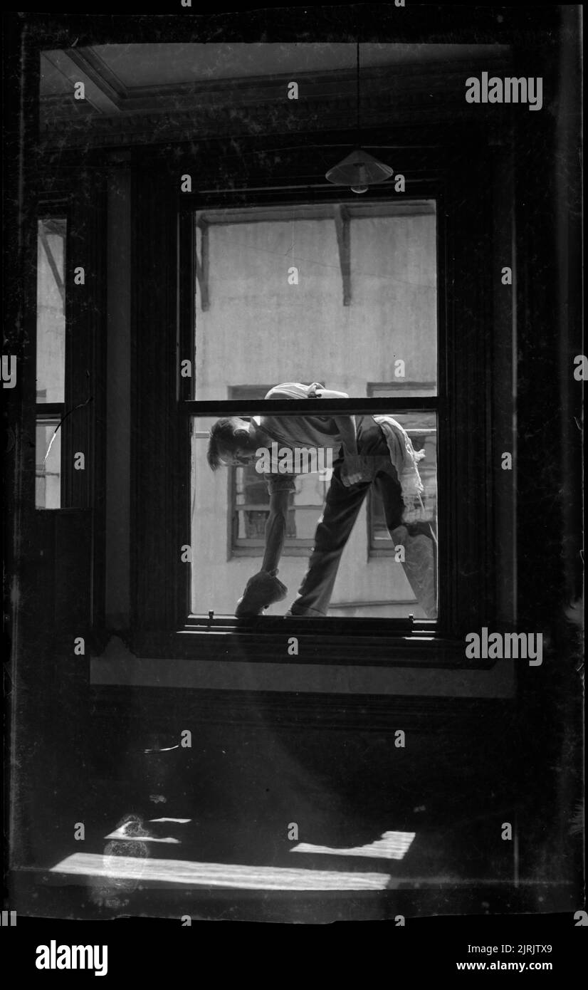 [Man cleaning window], 1920s to 1930s, by Roland Searle Stock Photo - Alamy