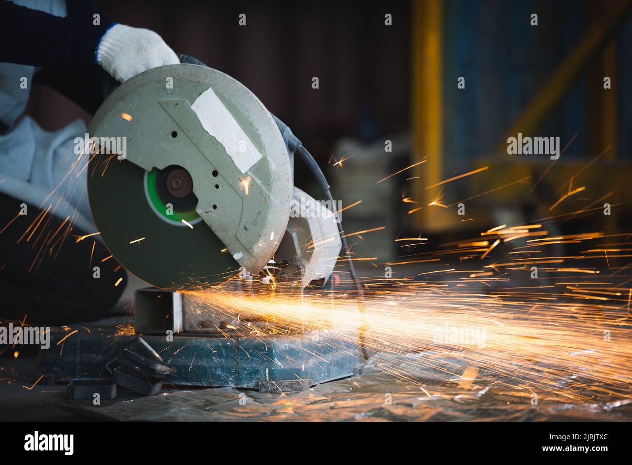 Cutting of a steel with splashes of sparks, Metal processing with angle ...