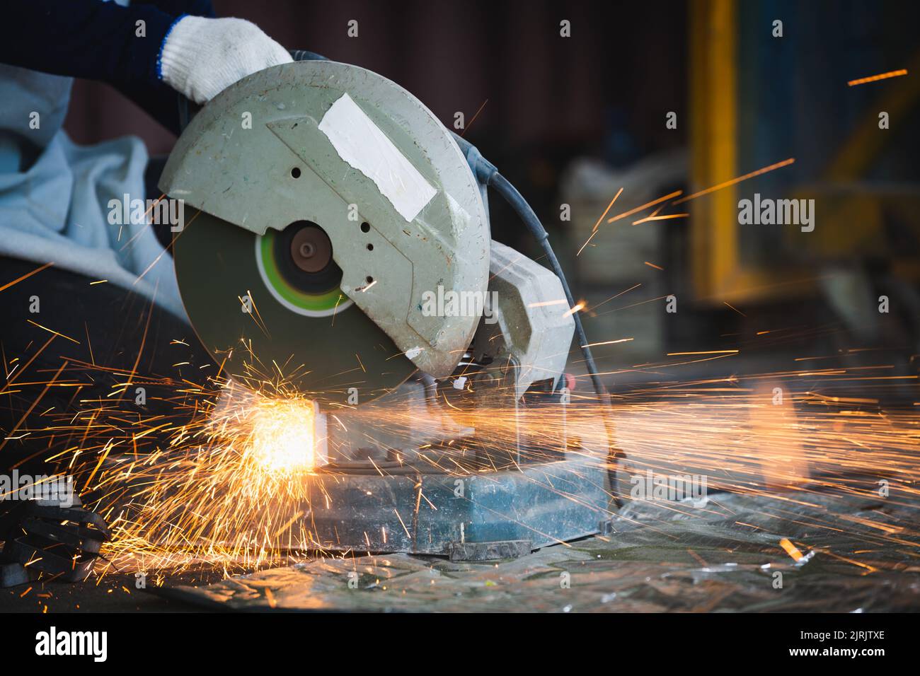 Cutting of a steel with splashes of sparks at construction site Stock ...