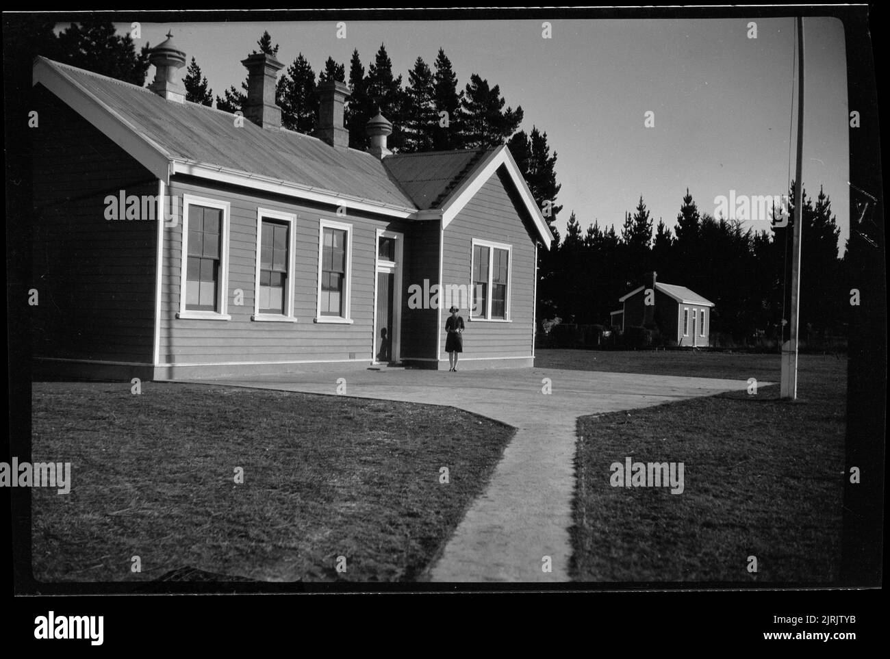 [Women standing beside building], 1920s to 1930s, by Roland Searle ...