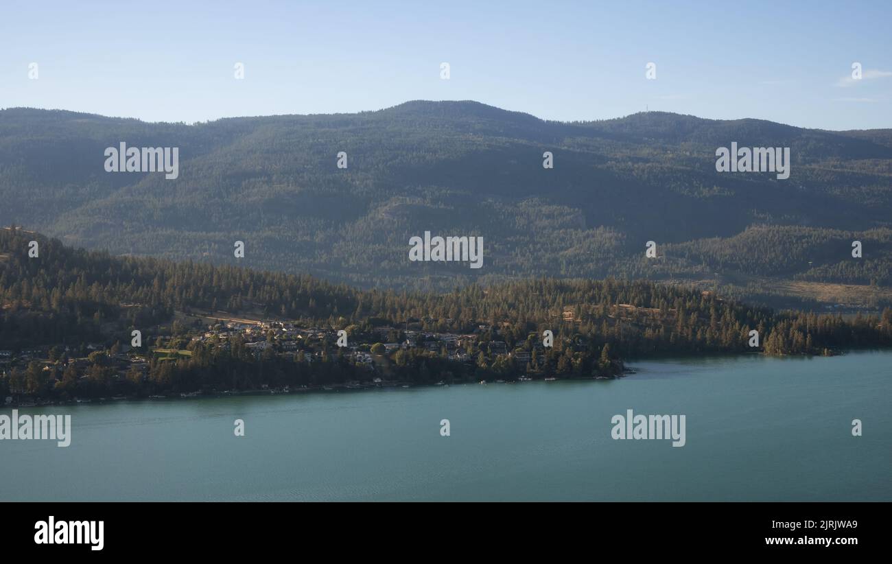Scenic View of Kalamalka Lake and a small City during sunny summer ...